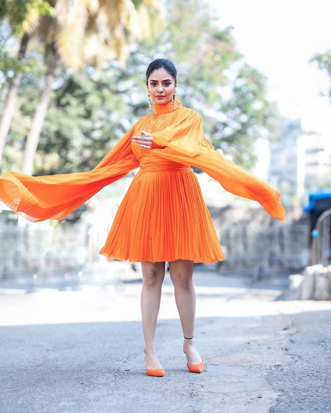 Sreemukhi Scintillating Pics In Orange