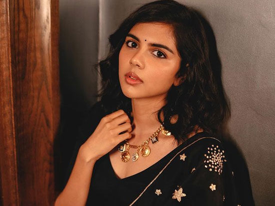 Astonishing Clicks Of Kalyani Priyadarshan In Black Saree